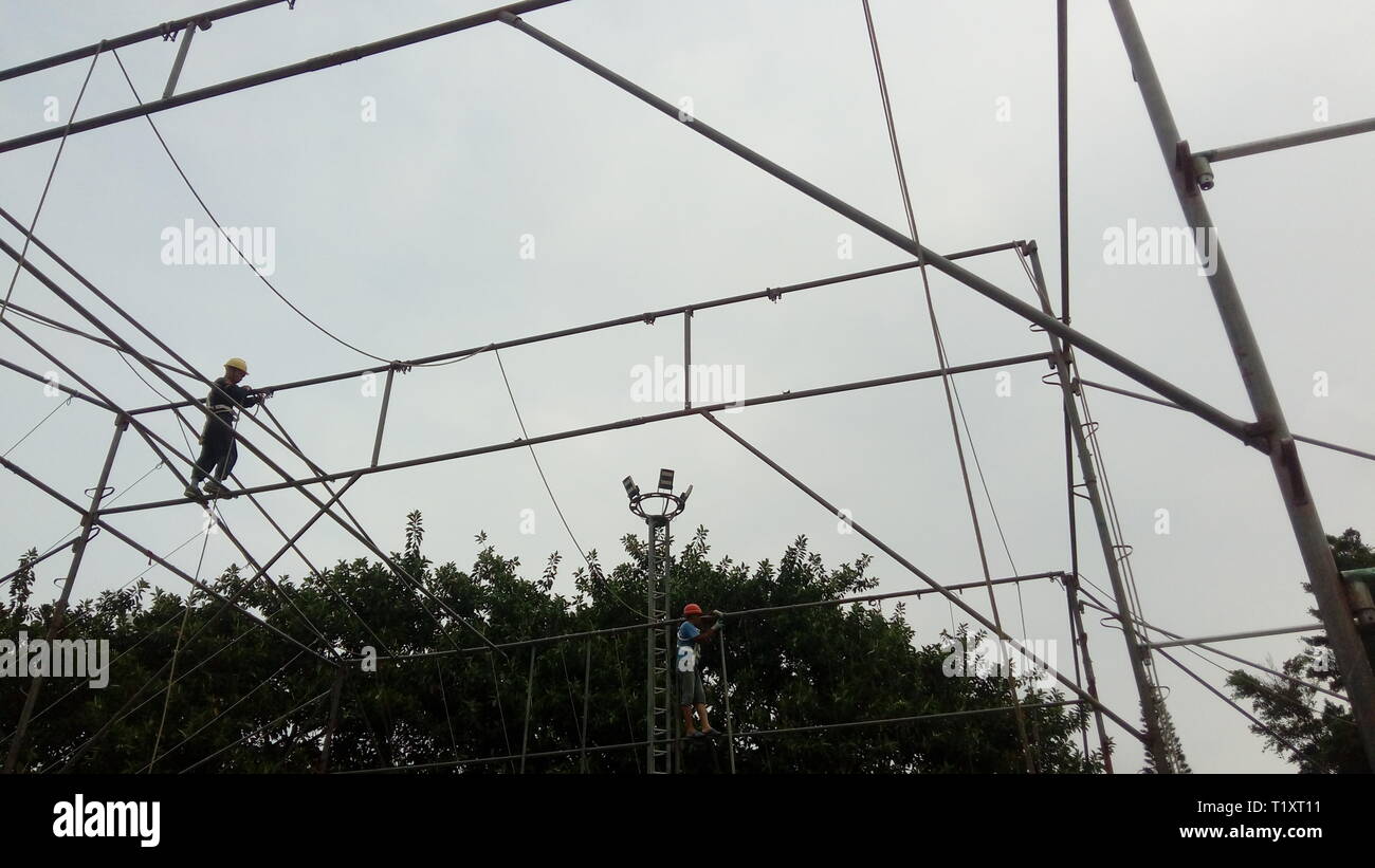Shenzhen, China: Workers are setting up a stage to welcome the arrival ...