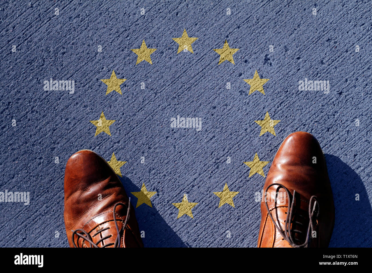 European Union flag on the floor - man looking down at his shoes Stock ...