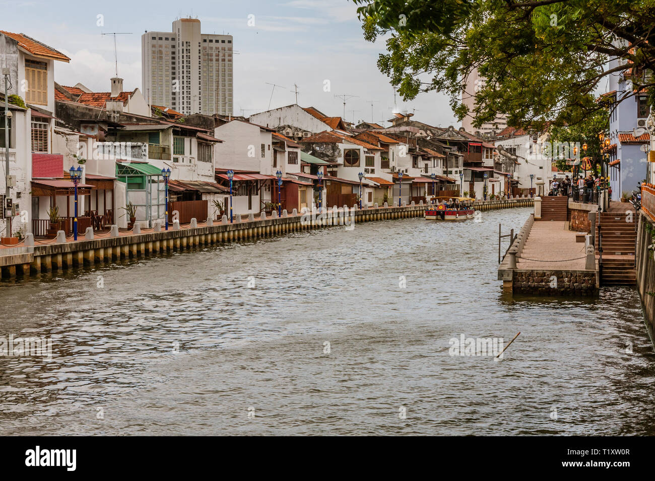 A cruise boat on the Melaka River in historical Melaka downtown ...