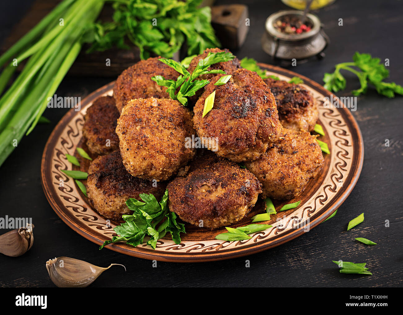 Juicy delicious meat cutlets on a dark table. Russian cuisine Stock ...