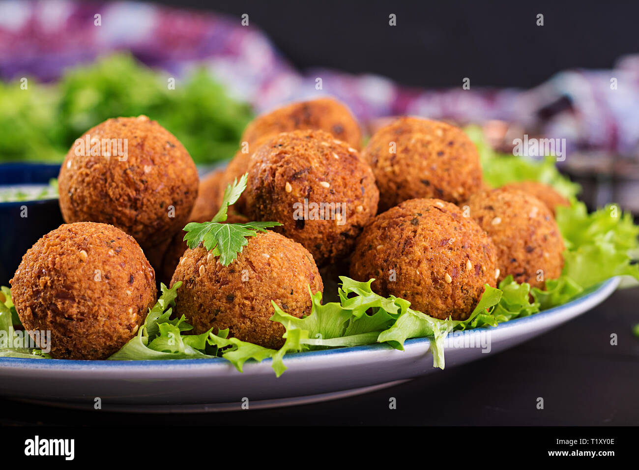 Falafel, hummus and pita. Middle eastern or arabic dishes on a dark ...