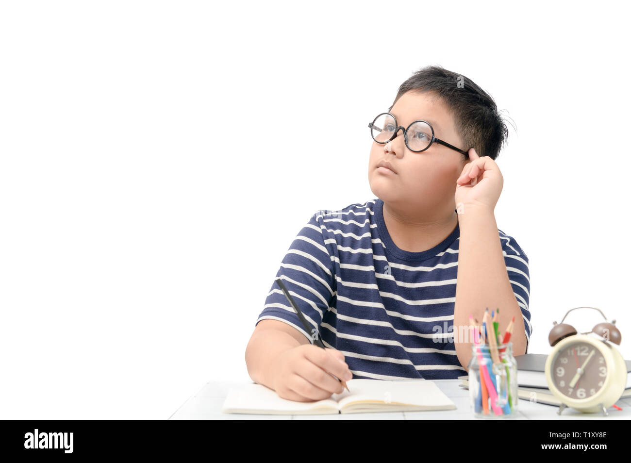 fat student thinking while doing his homework on table isolated on ...