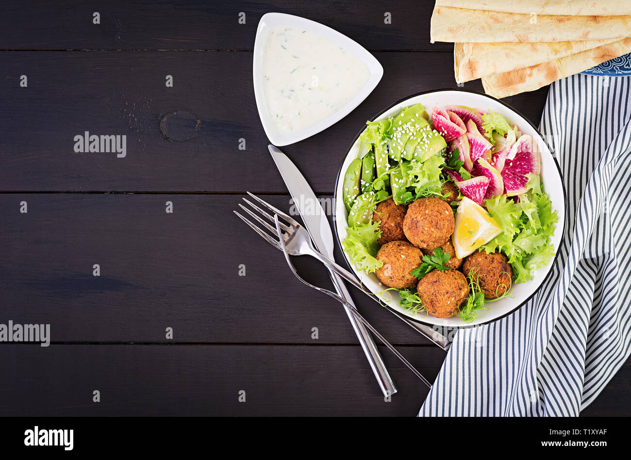 Falafel and fresh vegetables. Buddha bowl. Middle eastern or arabic ...