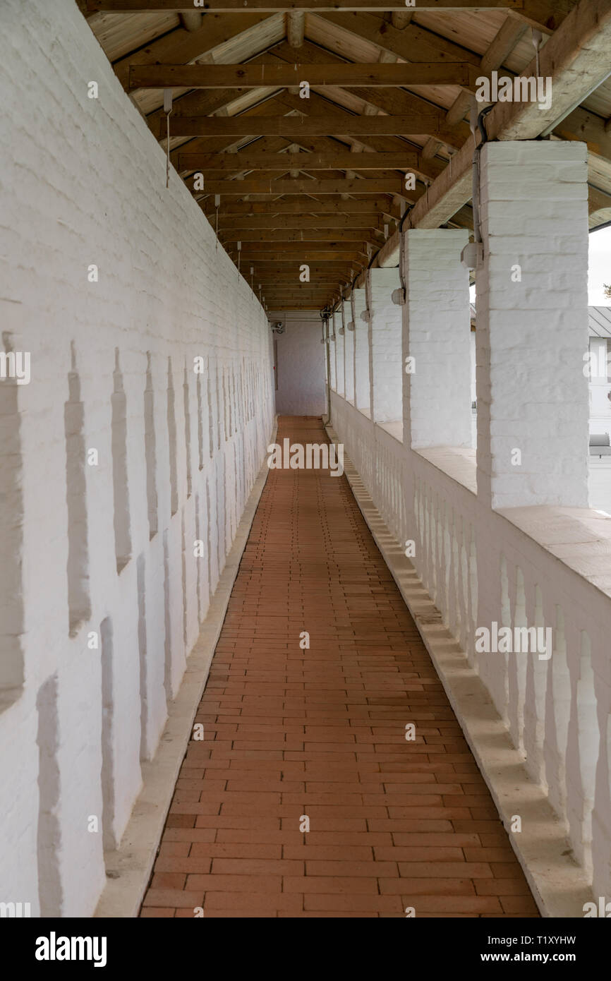 Long narrow corridor in an old building Stock Photo - Alamy