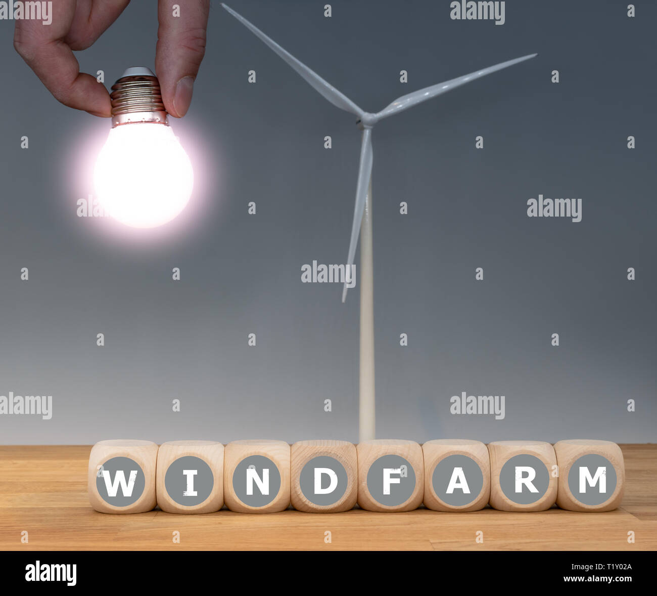 Symbol for green energy, Dice form the word "Wind-farm". A model wind ...