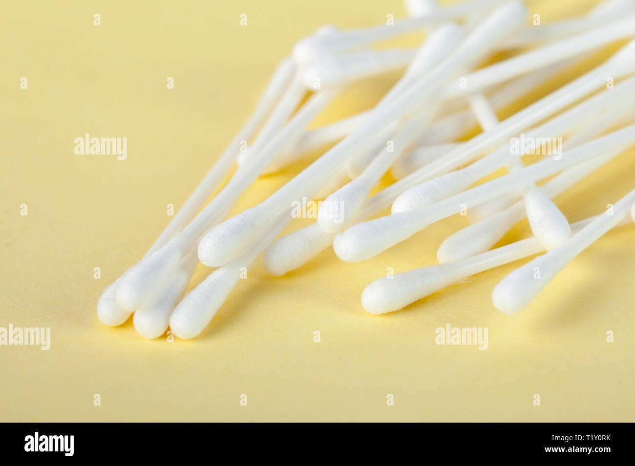 Yellow color ear cleaning hi-res stock photography and images - Alamy