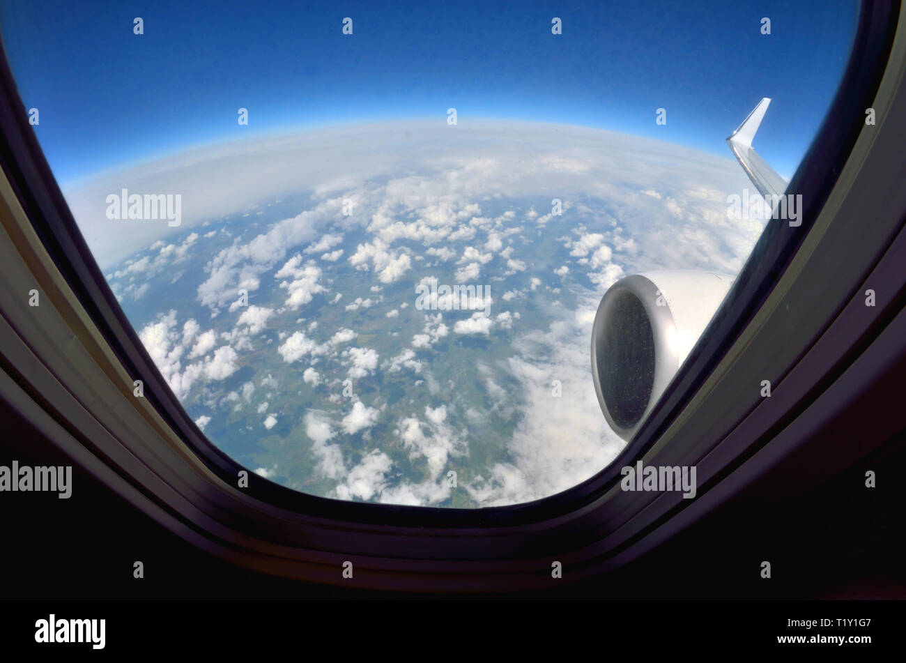 Looking over aircraft wing in flight and clouds Stock Photo - Alamy