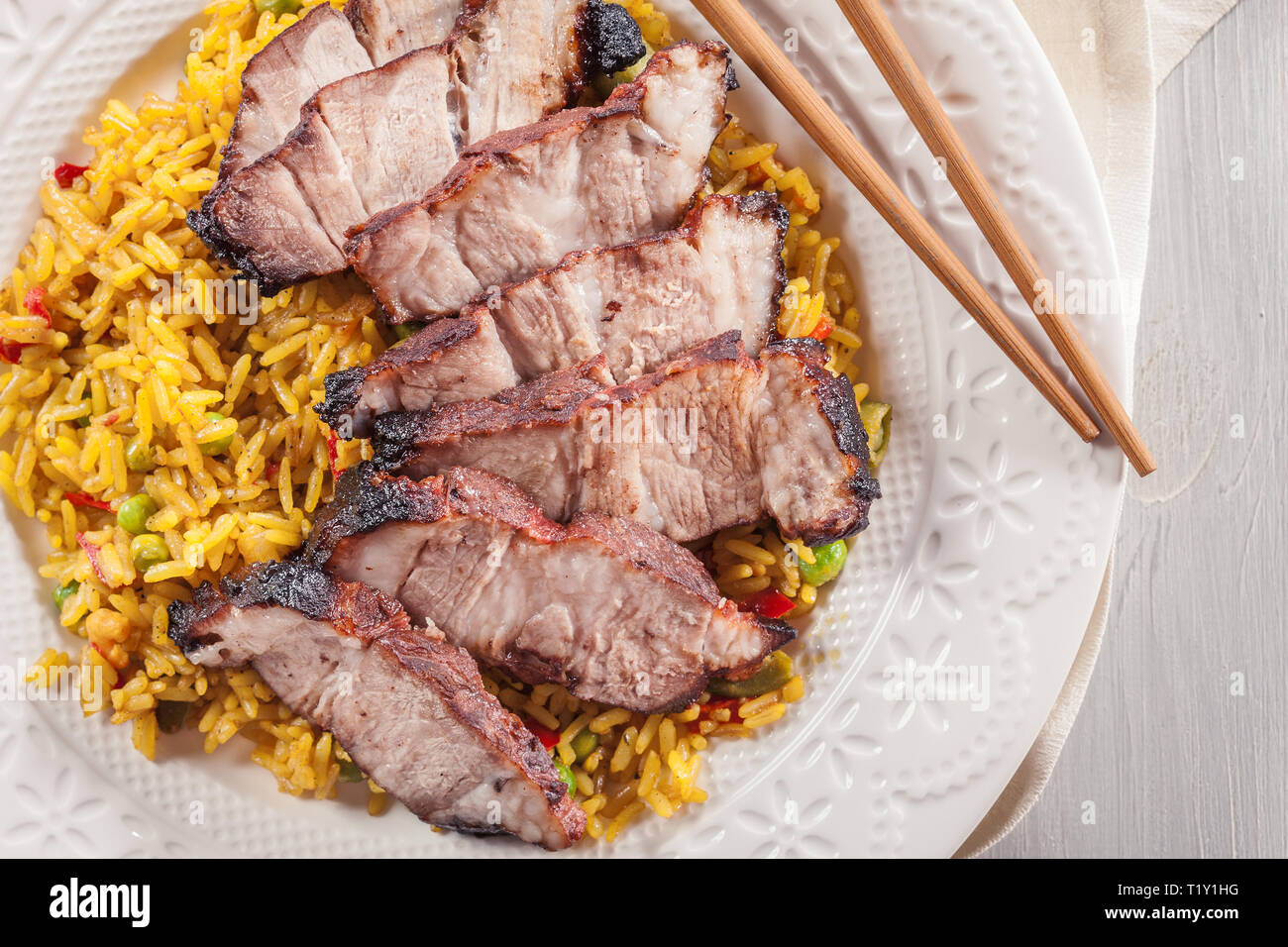 Char Siu Pork - Chinese roasted pork shoulder with fried rice on plate ...