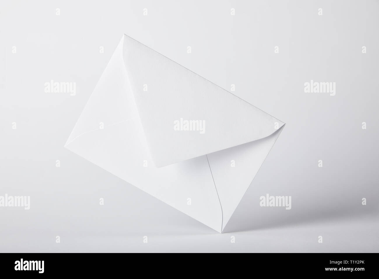 white and empty envelope on grey background with copy space Stock Photo ...