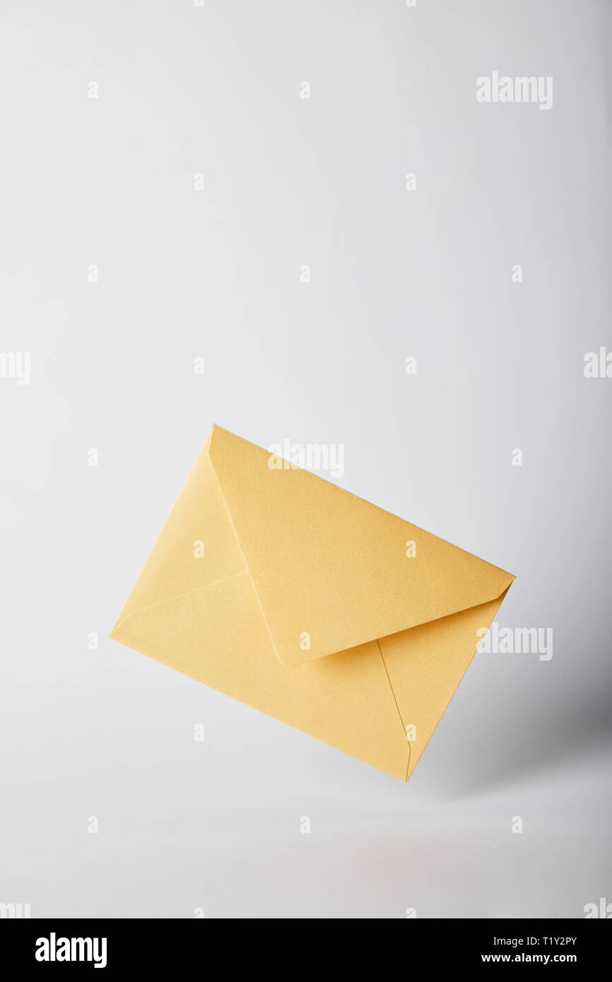 yellow and bright envelope on grey background with copy space Stock ...