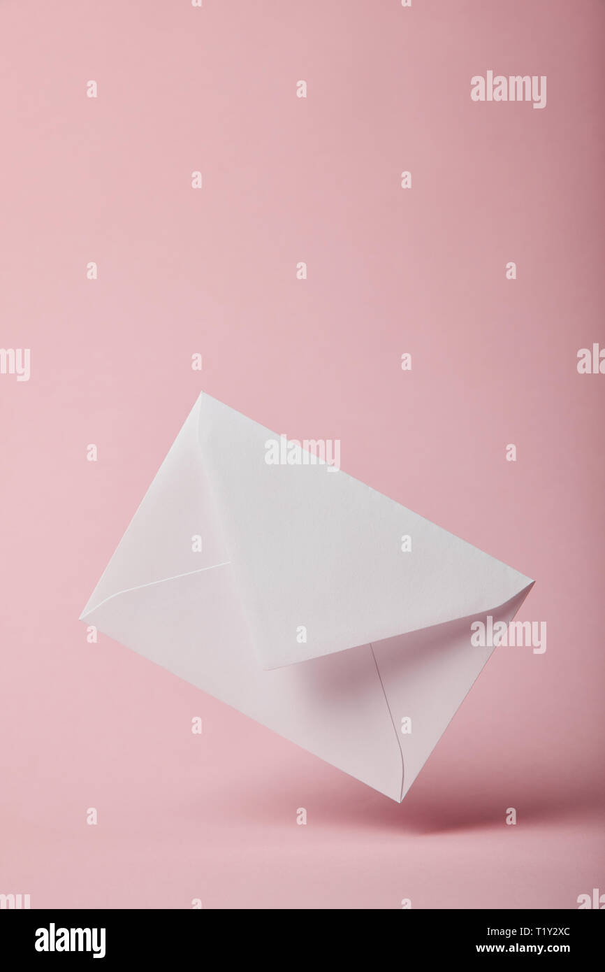 white and empty envelope on pink background with copy space Stock Photo ...