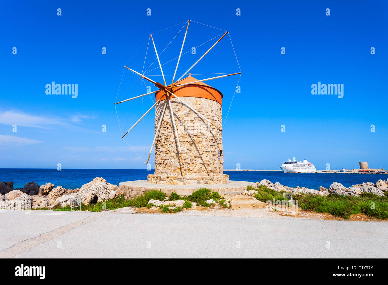 Windmills at the seafront in the city of Rhodes in Rhodes island in ...