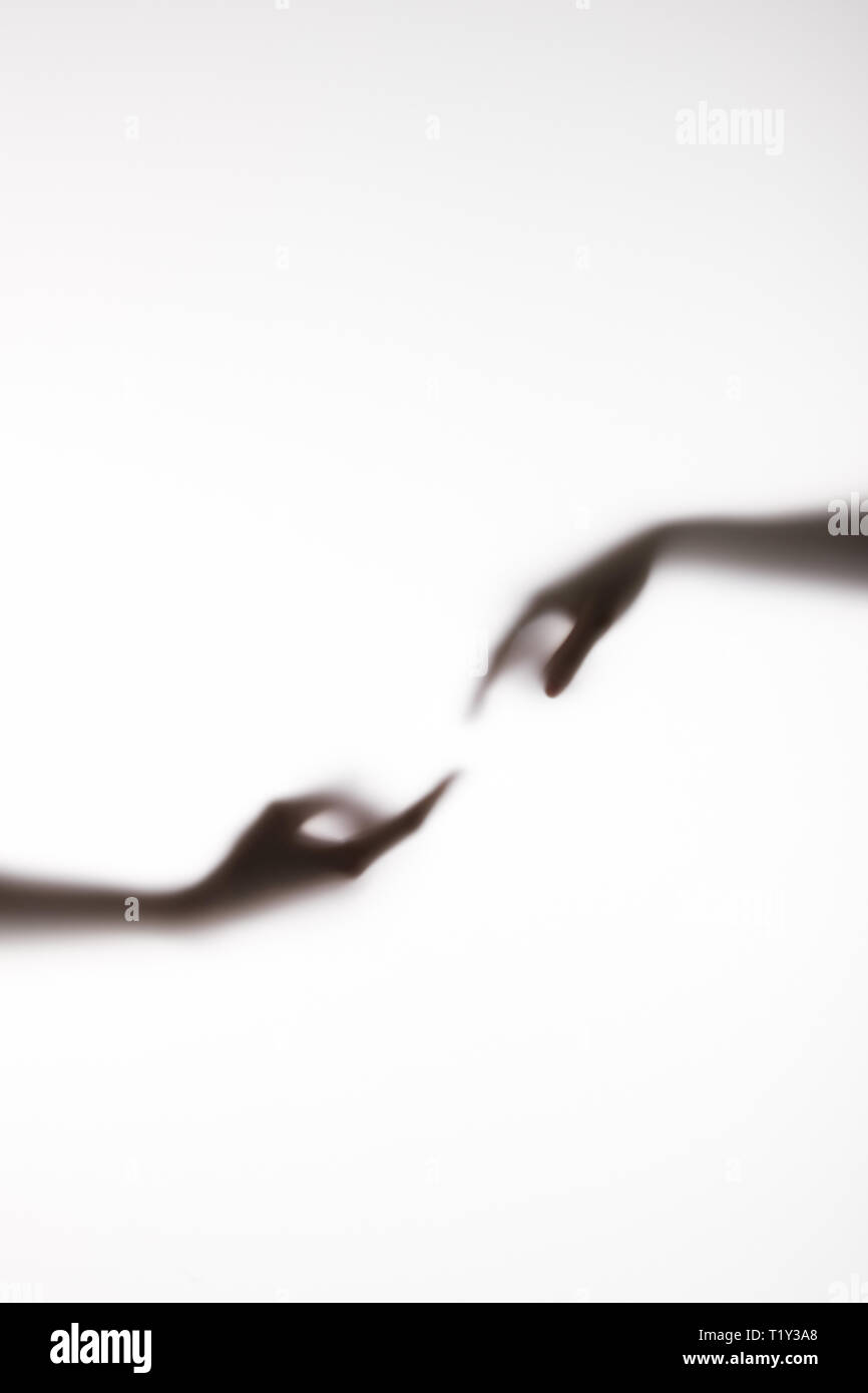 Two hands touching silhouette hi-res stock photography and images - Alamy
