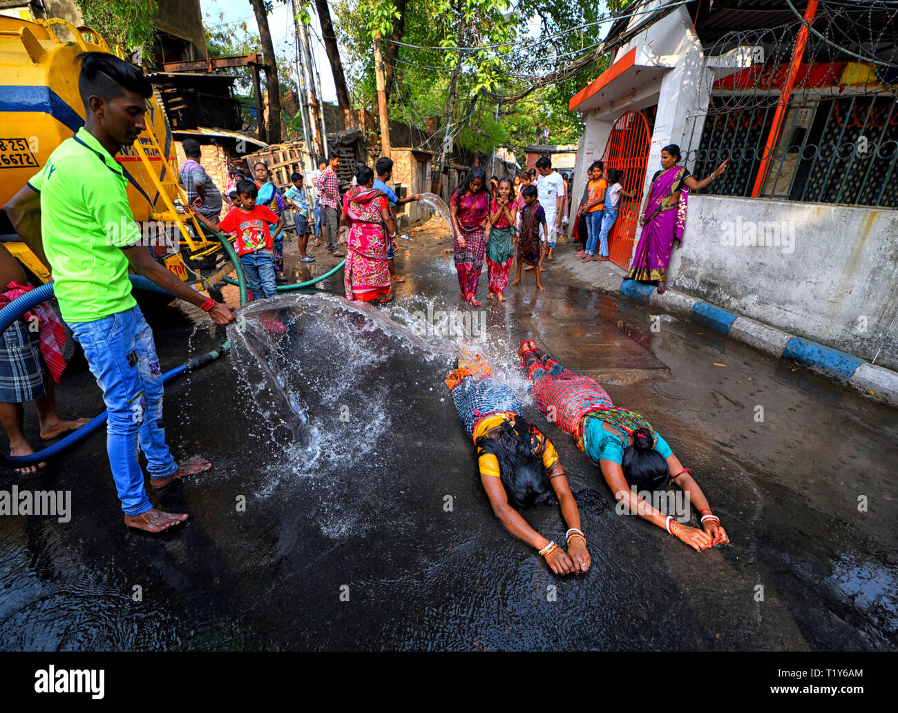 Hindu people are seen lying on the ground seen lying on the ground as a ...