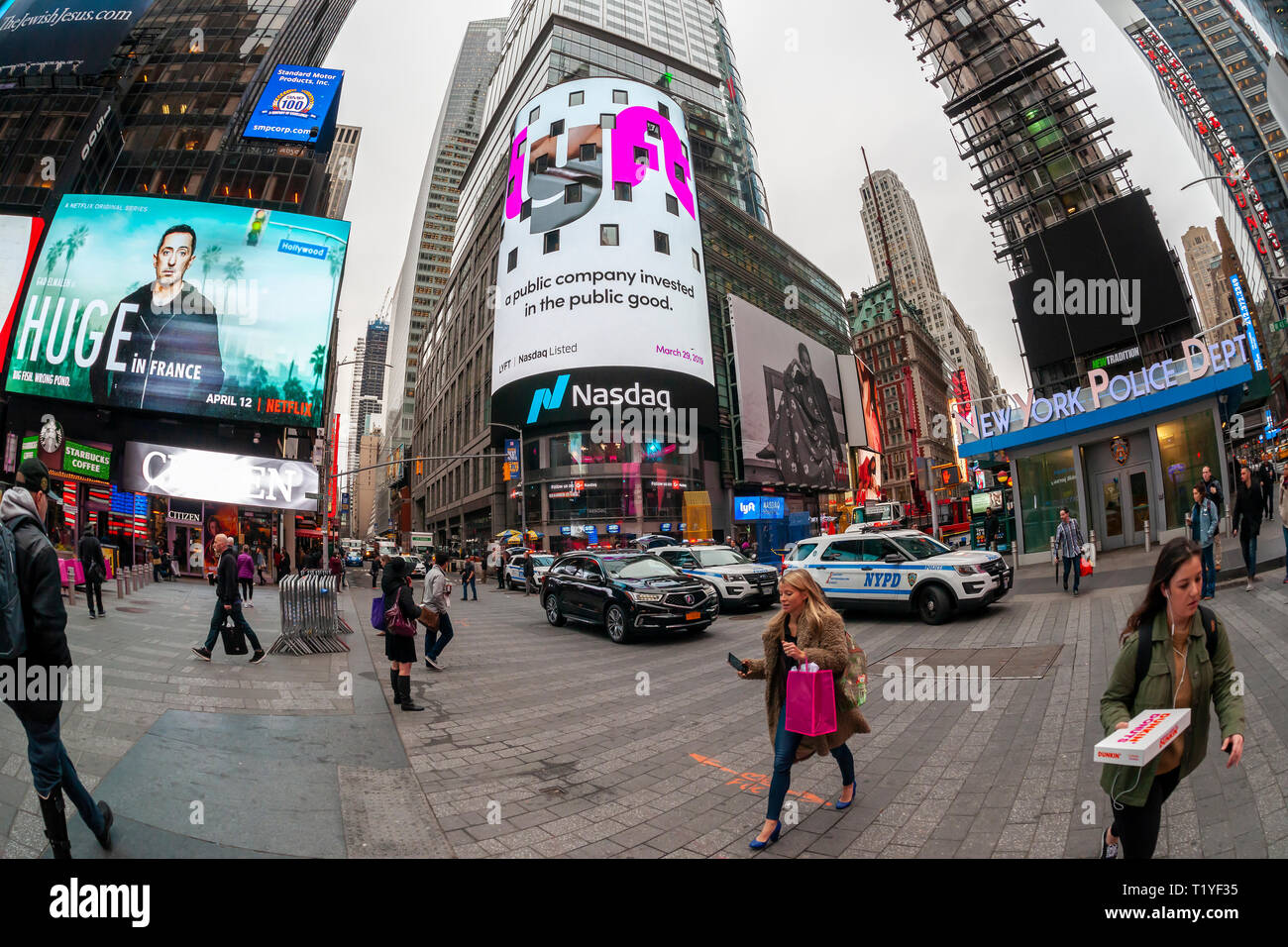 New York, USA. 29th Mar 2019. The giant video screen on the Nasdaq ...