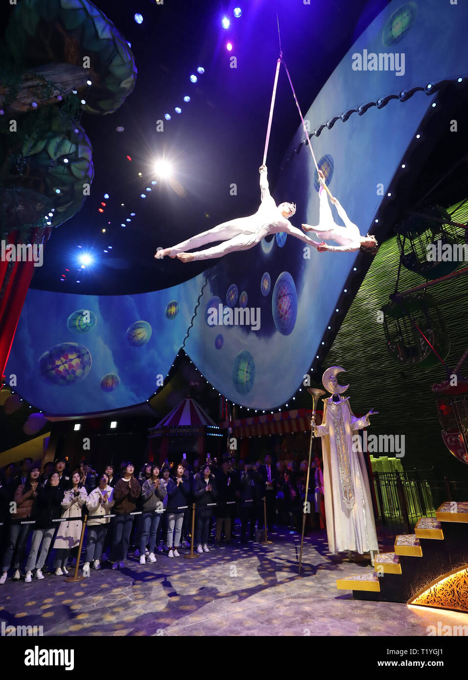 Performance at theme park A troupe puts on an aerial show during a ...