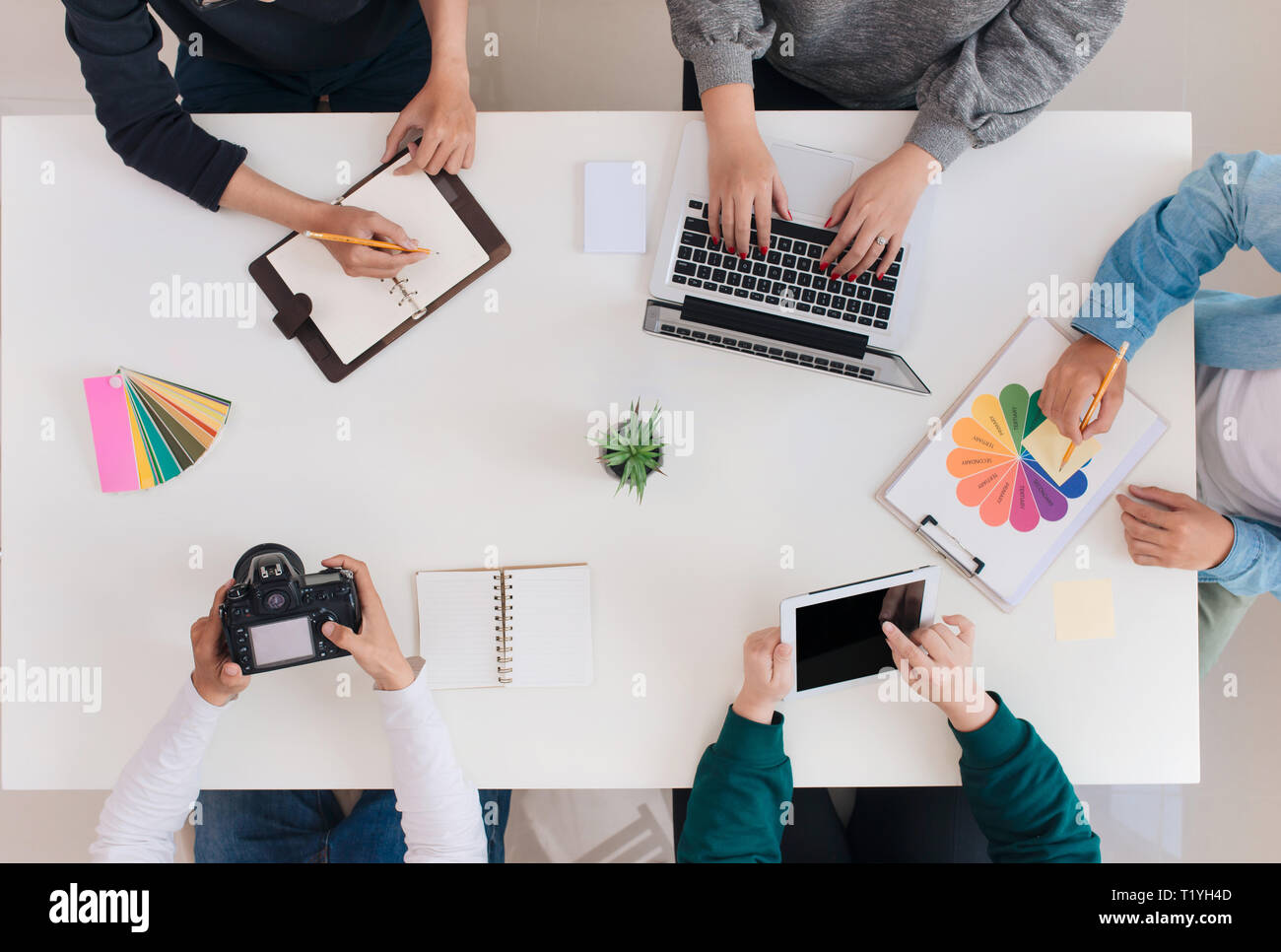 Creative team having brainstorming meeting hi-res stock photography and ...