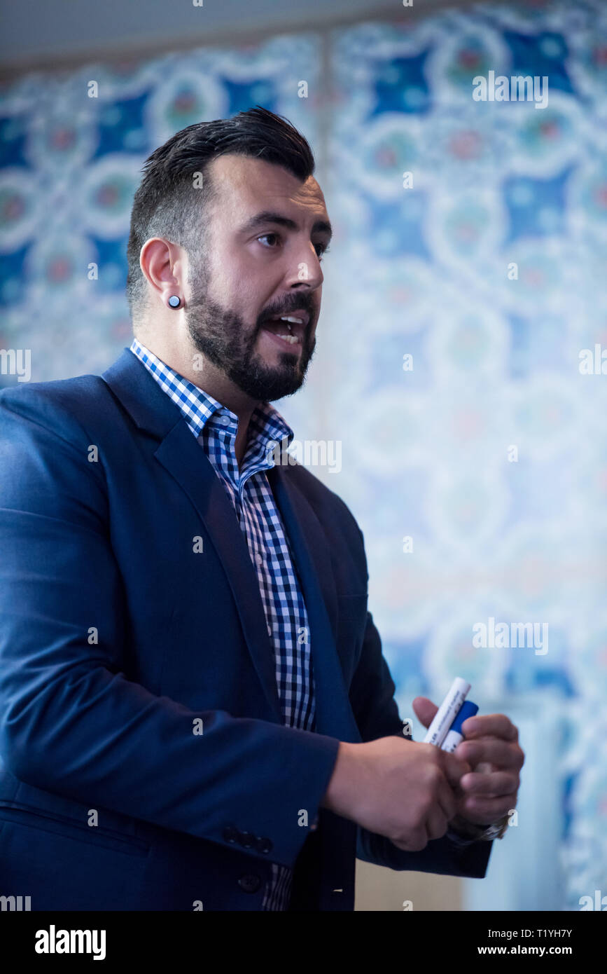 young successful businessman at business conference room with public ...