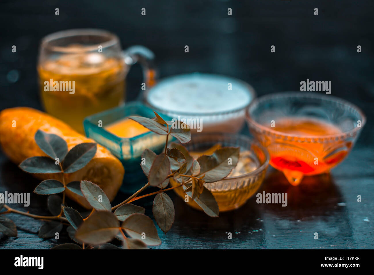 Floral face pack of curd,cucumber, aloe vera gel and honey on wooden ...