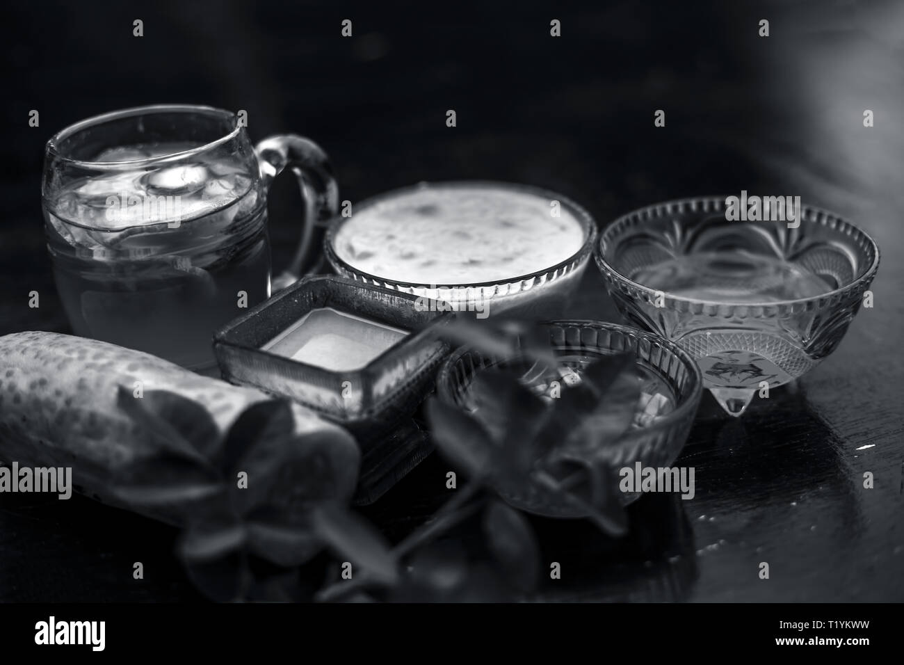 Floral face pack of curd,cucumber, aloe vera gel and honey on wooden ...