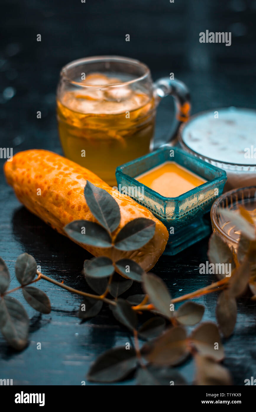 Floral face pack of curd,cucumber, aloe vera gel and honey on wooden ...