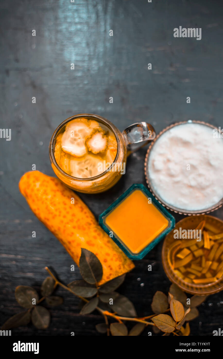 Floral face pack of curd,cucumber, aloe vera gel and honey on wooden ...