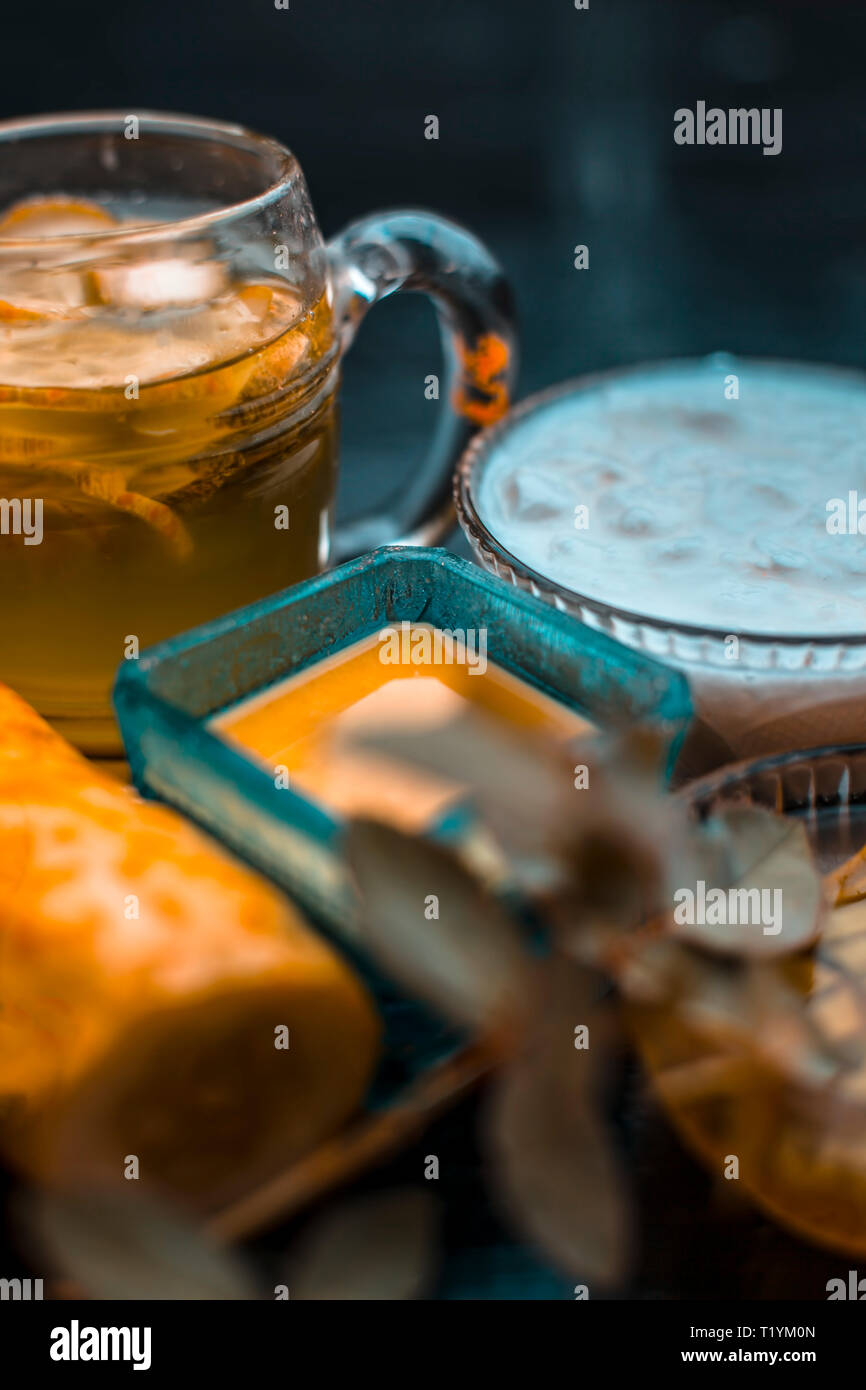 Floral face pack of curd,cucumber, aloe vera gel and honey on wooden ...