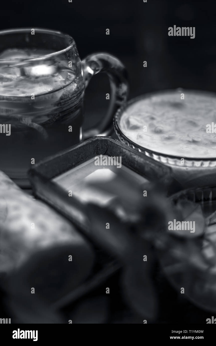 Floral face pack of curd,cucumber, aloe vera gel and honey on wooden ...