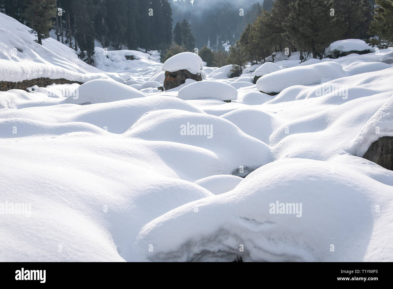 Boulders and rocks covered with snow Stock Photo - Alamy