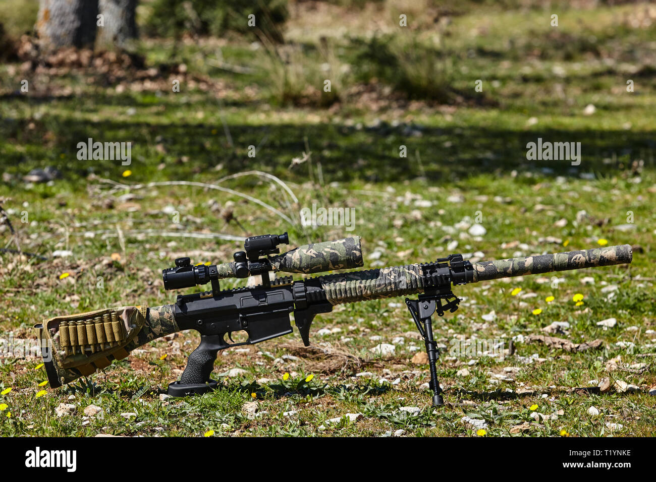 Sniper's gun on the ground.Military concept Stock Photo - Alamy