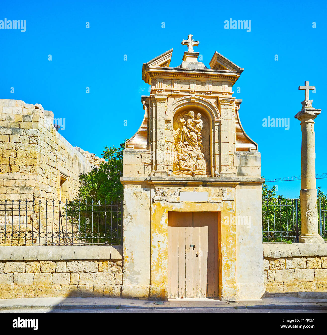 Preserved ruins of the medieval Parish Church with facade wall and ...