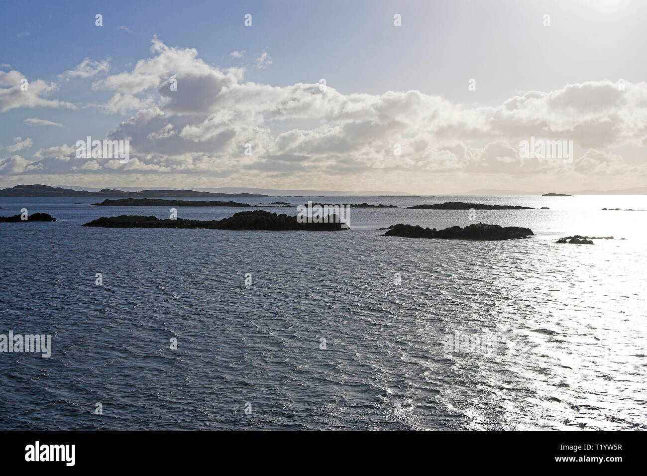 Rocks at the eastern side of the entrance to Port Ellen harbour, island ...