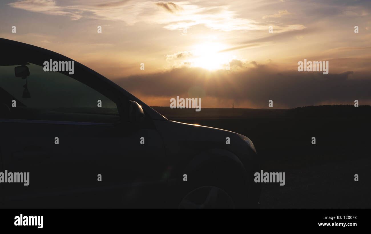 Car on highway with sunset landscape - Tourism concept Stock Photo - Alamy