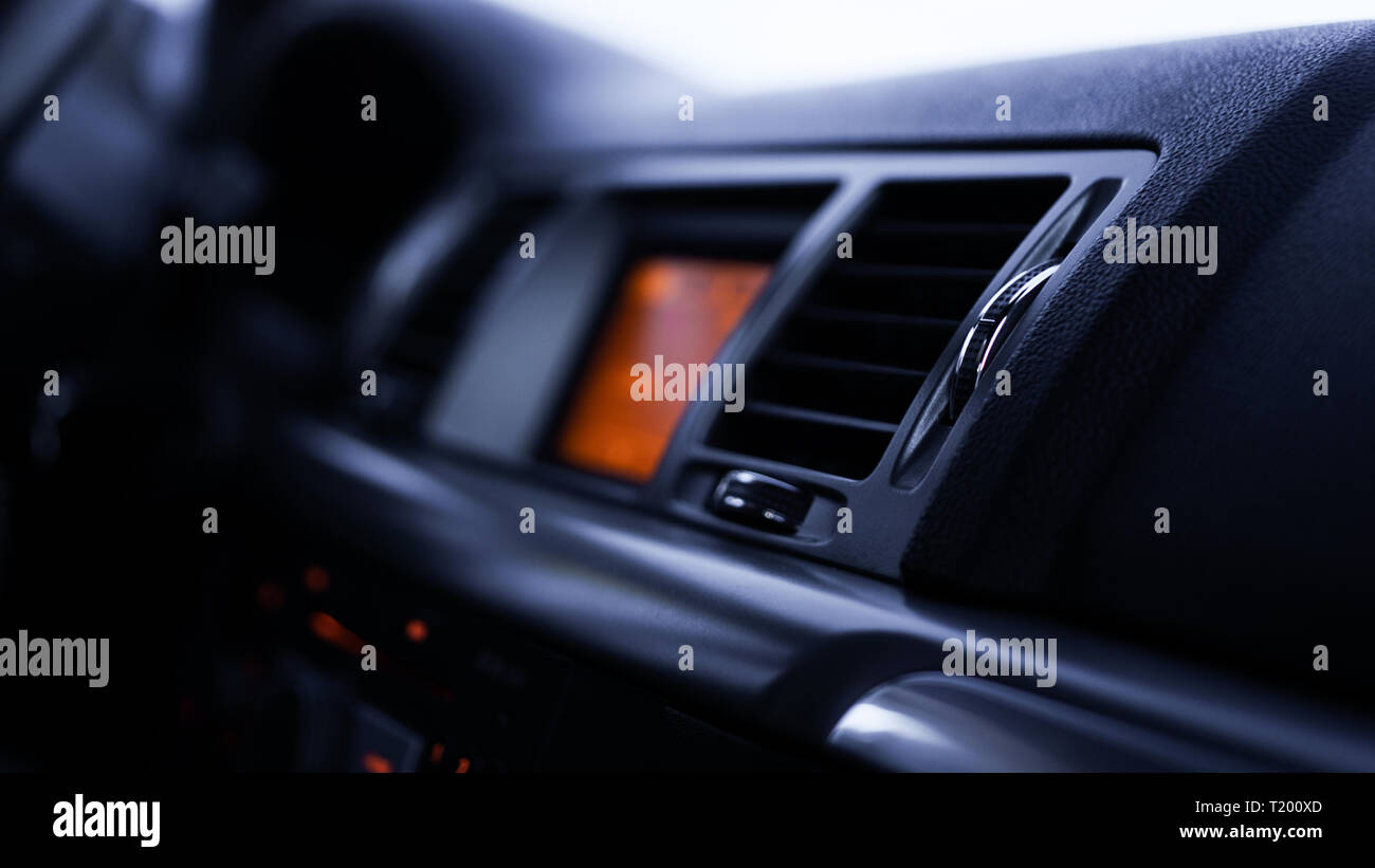 Buttons of radio, dashboard, climate control in car close up - black ...