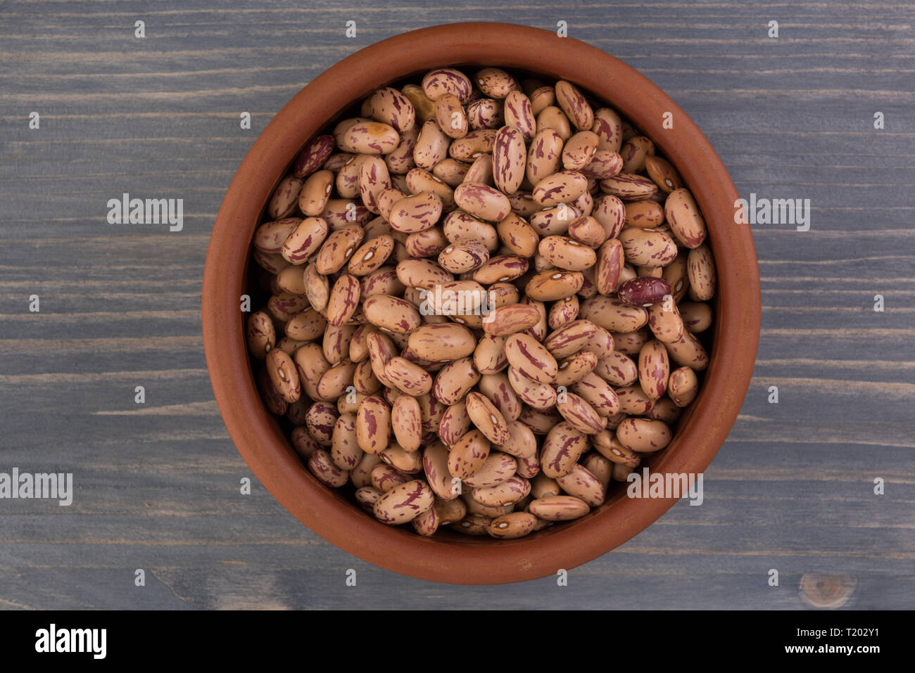 A plate of beans on wooden table background Stock Photo - Alamy