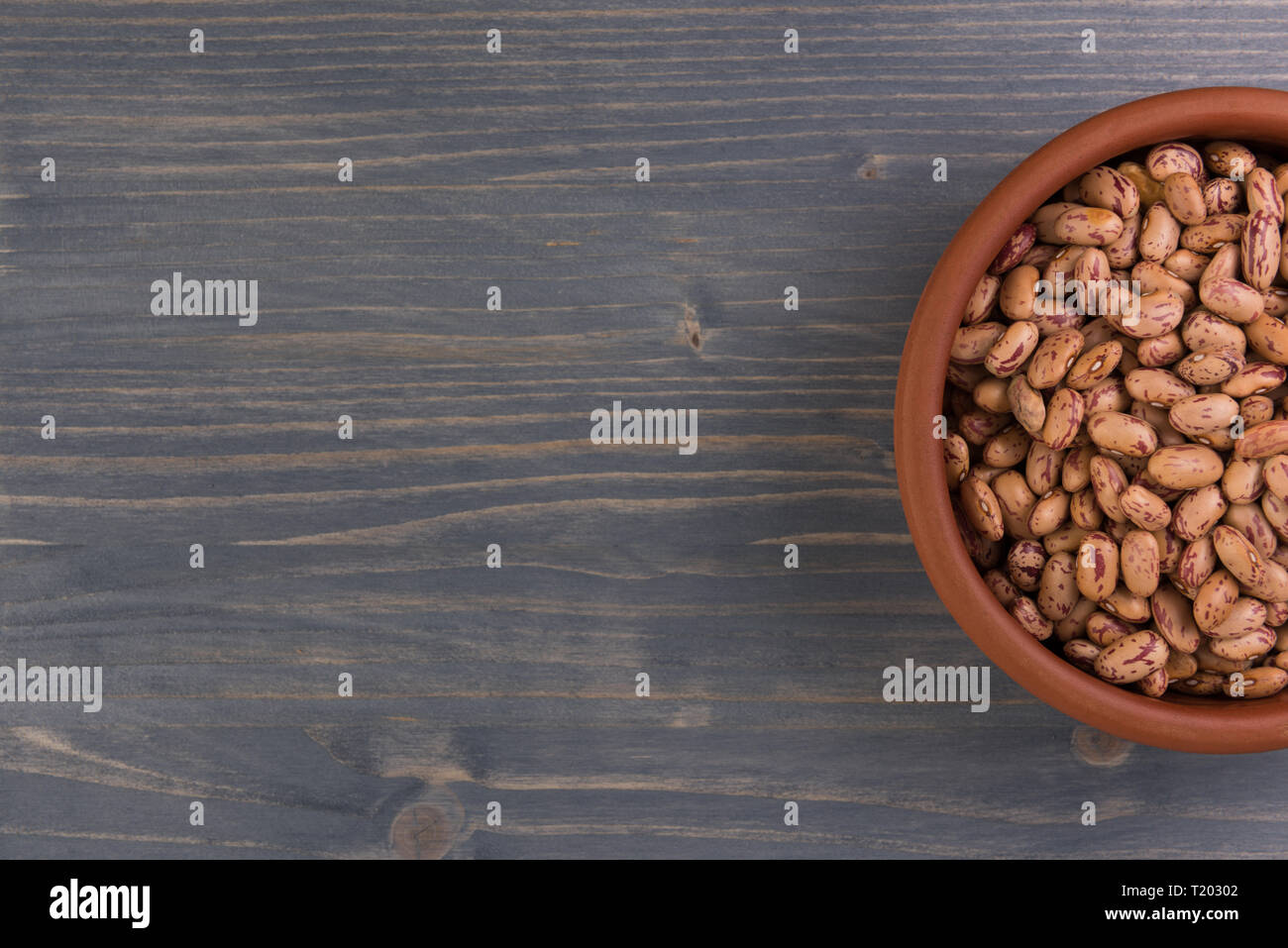 A plate of beans on wooden table background Stock Photo - Alamy