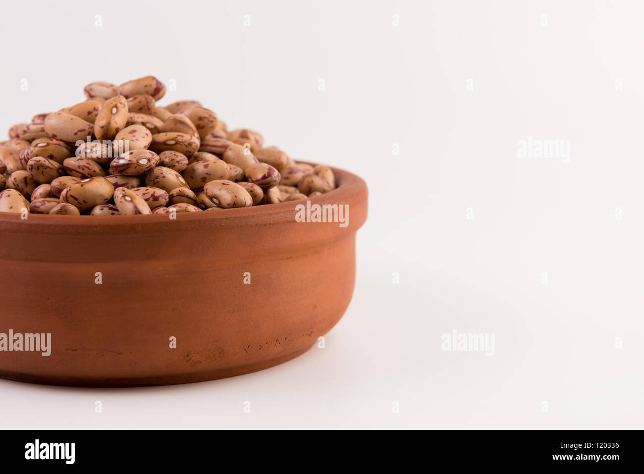 A plate of beans on white background Stock Photo - Alamy