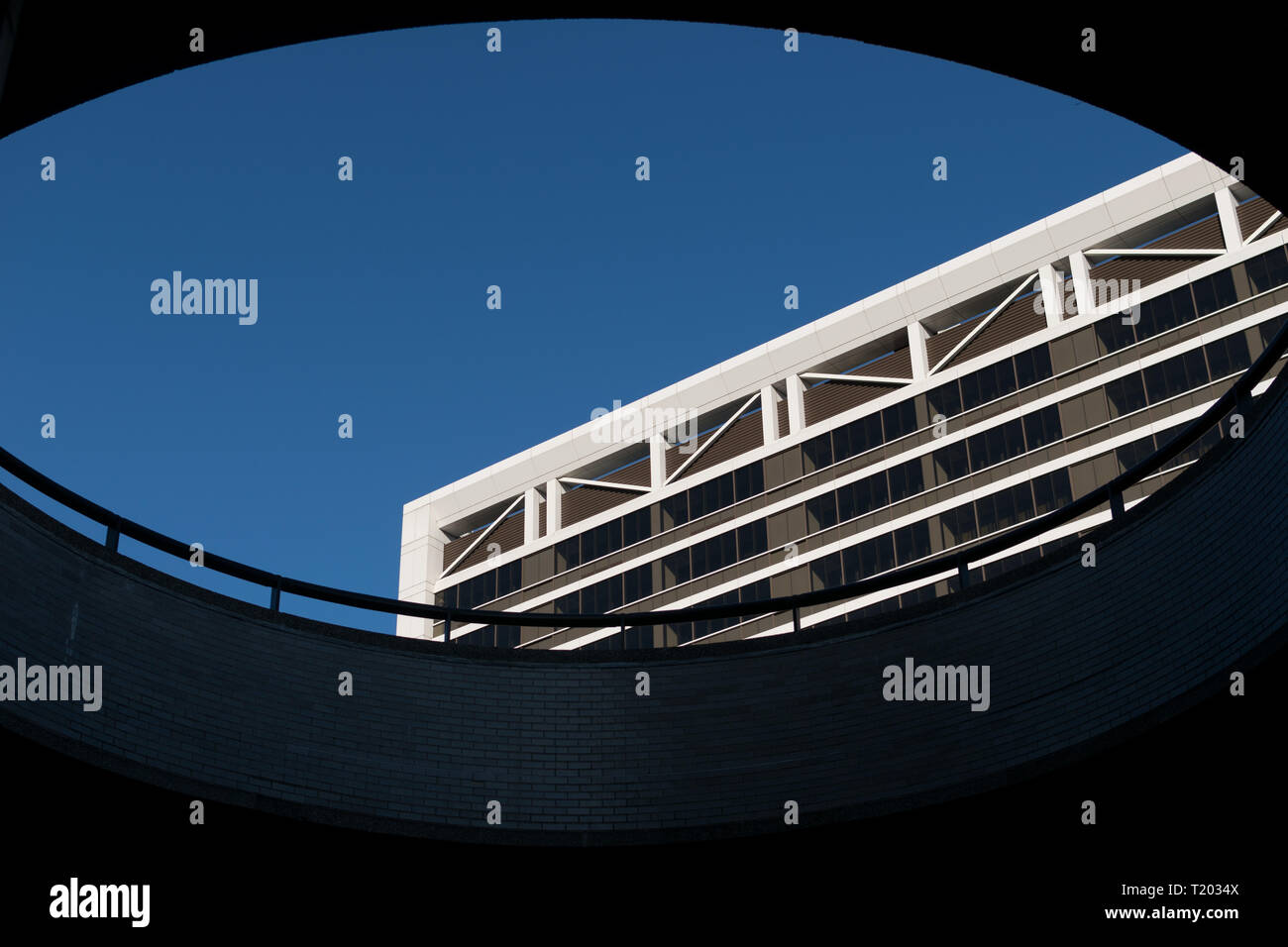 Tall New York City building seen through an underpass opening, Harlem ...
