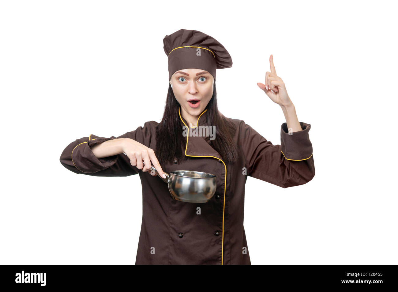 chef raised his finger up holding pan in his hand isolated on white ...
