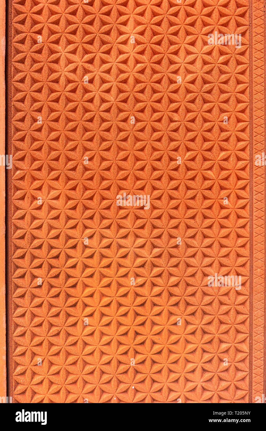 Cladding in terracotta-coloured concrete decorated with Egyptian motifs ...