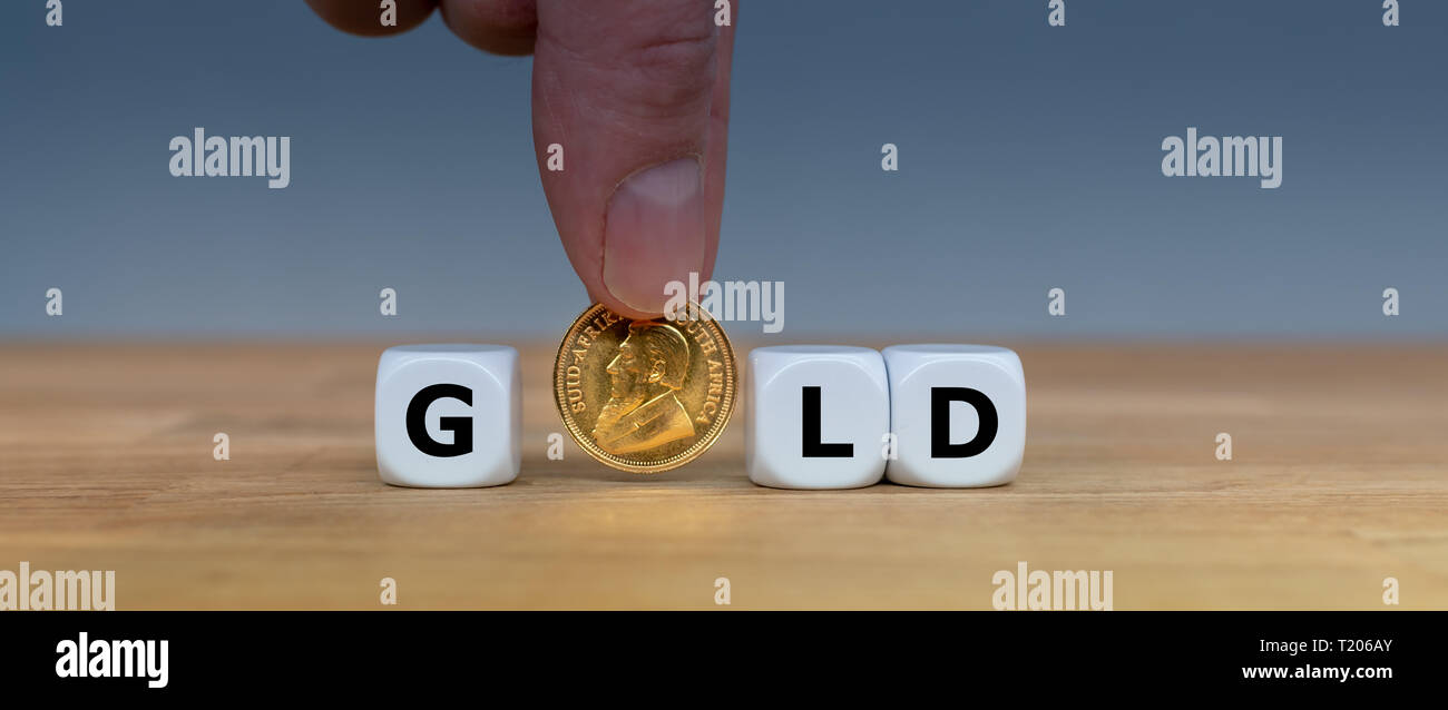 Dice and a gold coin form the word "GOLD Stock Photo - Alamy