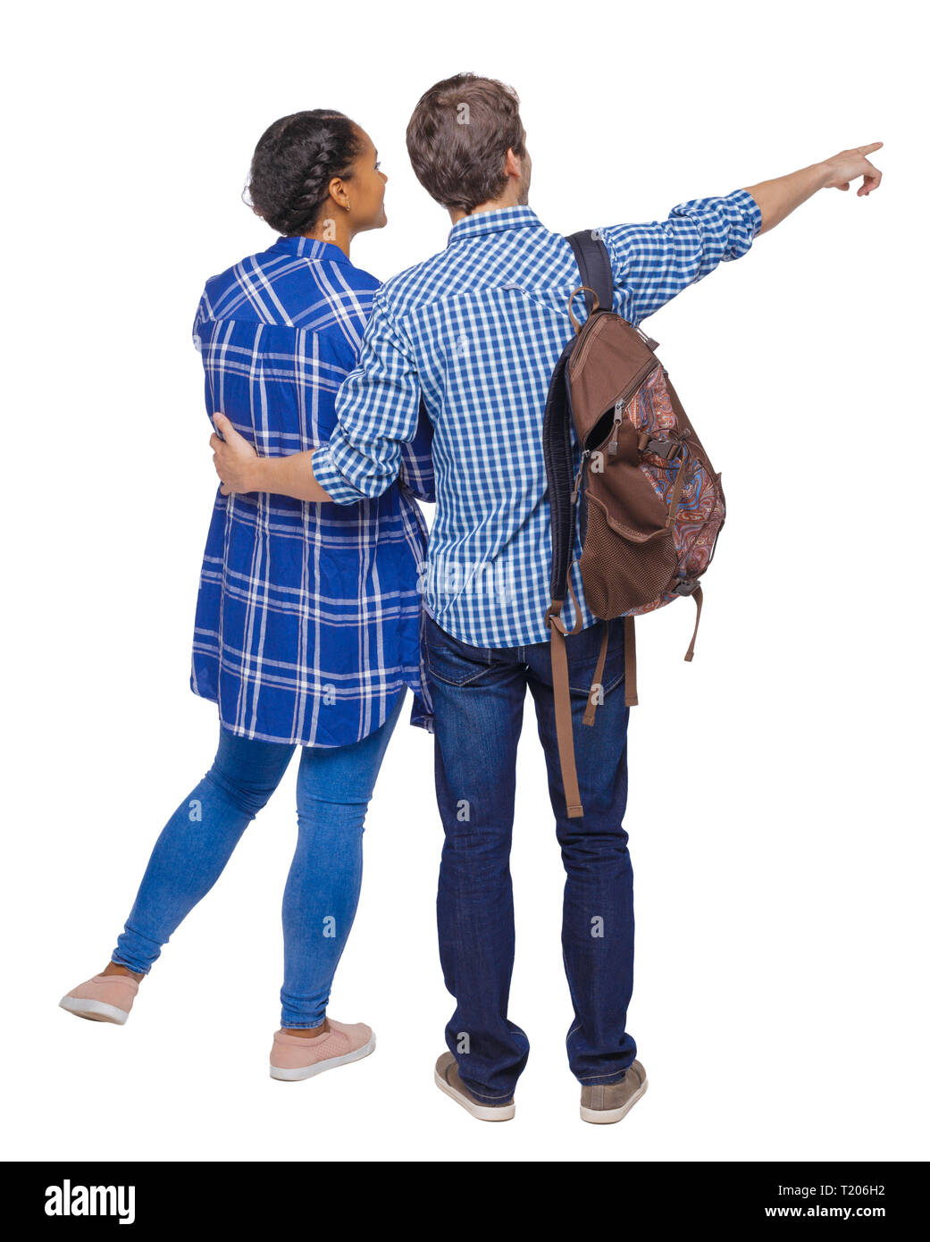 Back view of the interracial who hugs and points out. Rear view people ...