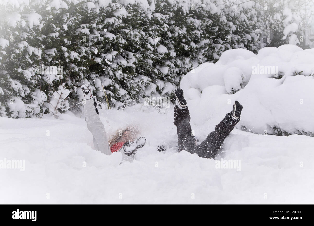 Mother and child jumping in deep snow, having fun Stock Photo - Alamy