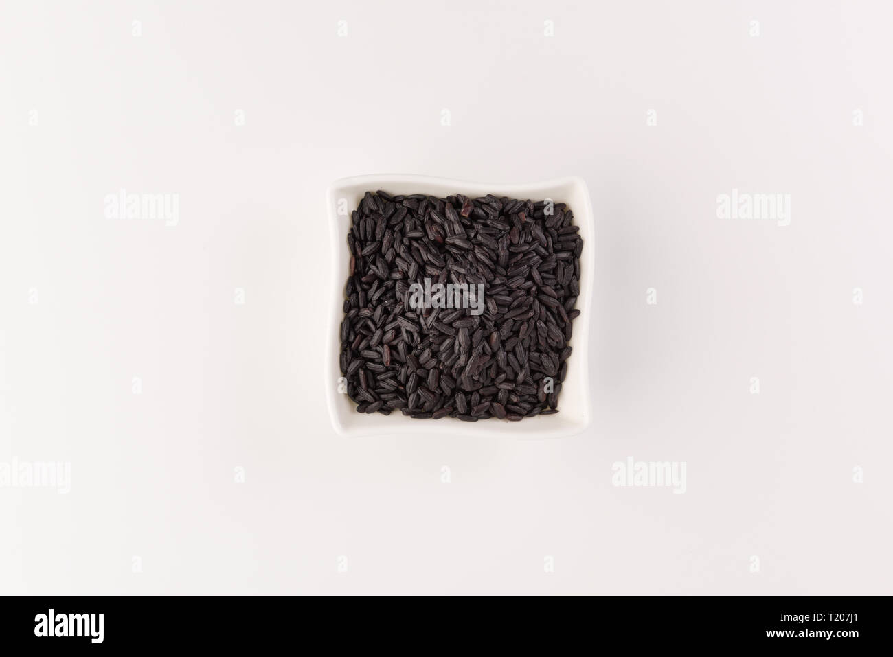 bowl of black wild rice isolated on white background Stock Photo - Alamy