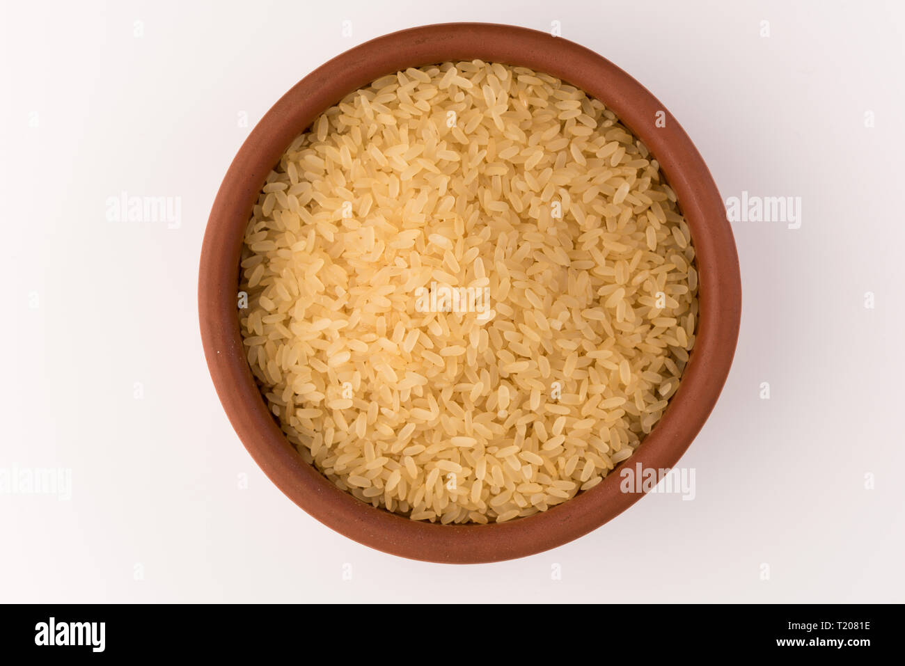 white rice in bowl isolated on white background Stock Photo - Alamy