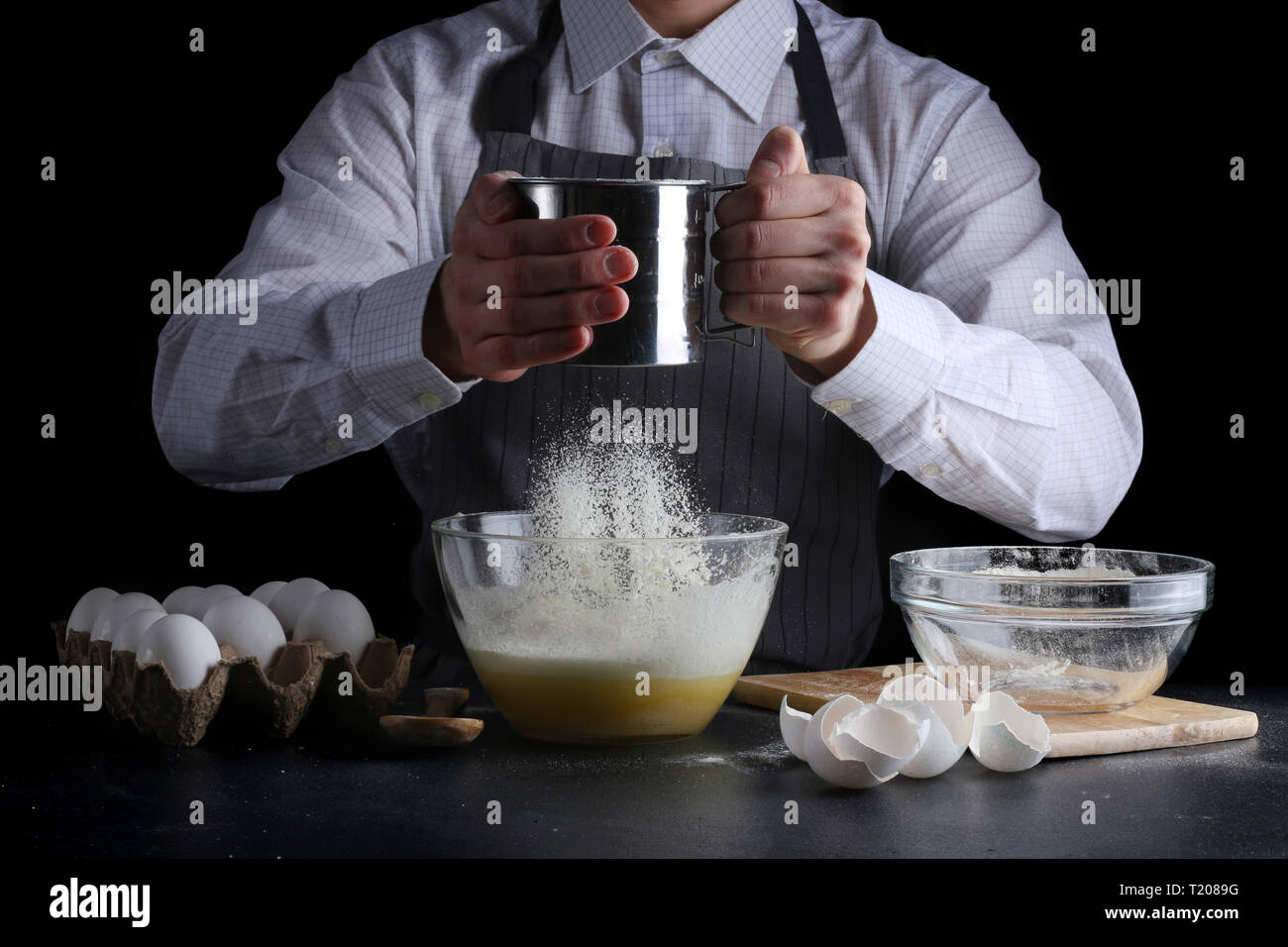 Man hands pouring flour in hi-res stock photography and images - Alamy