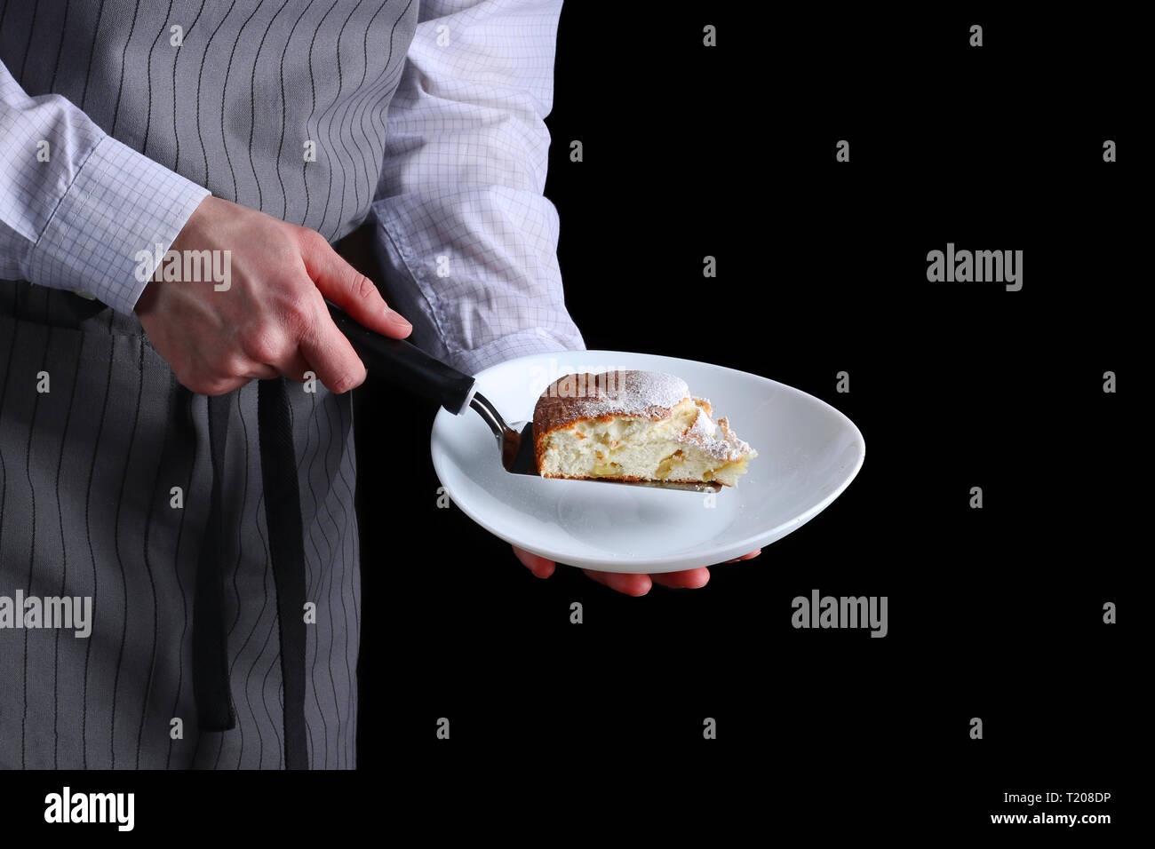 chef serves the pie on dark background. pie recipe concept Stock Photo ...