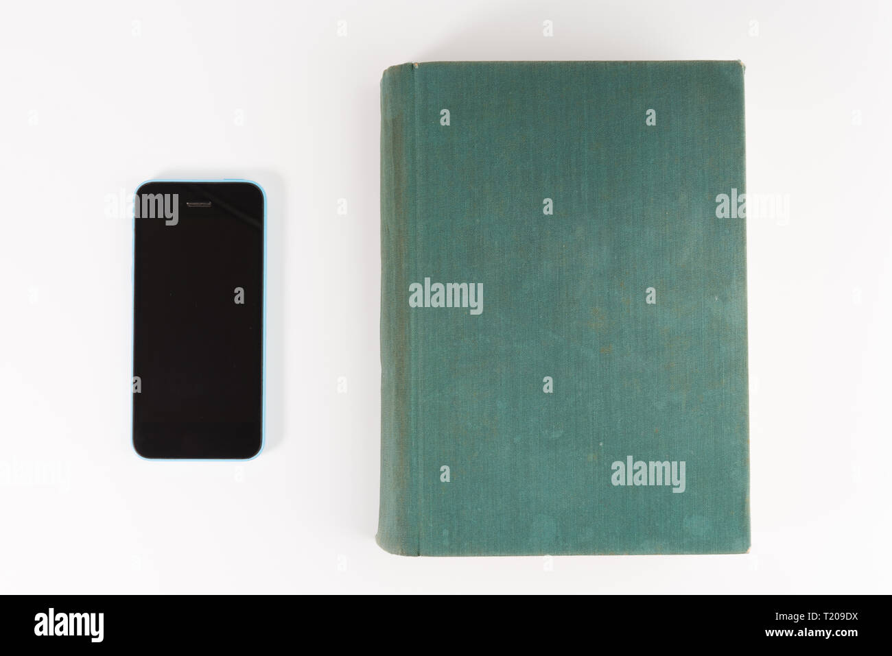 Smartphone versus old paper book, isolated on white background Stock ...