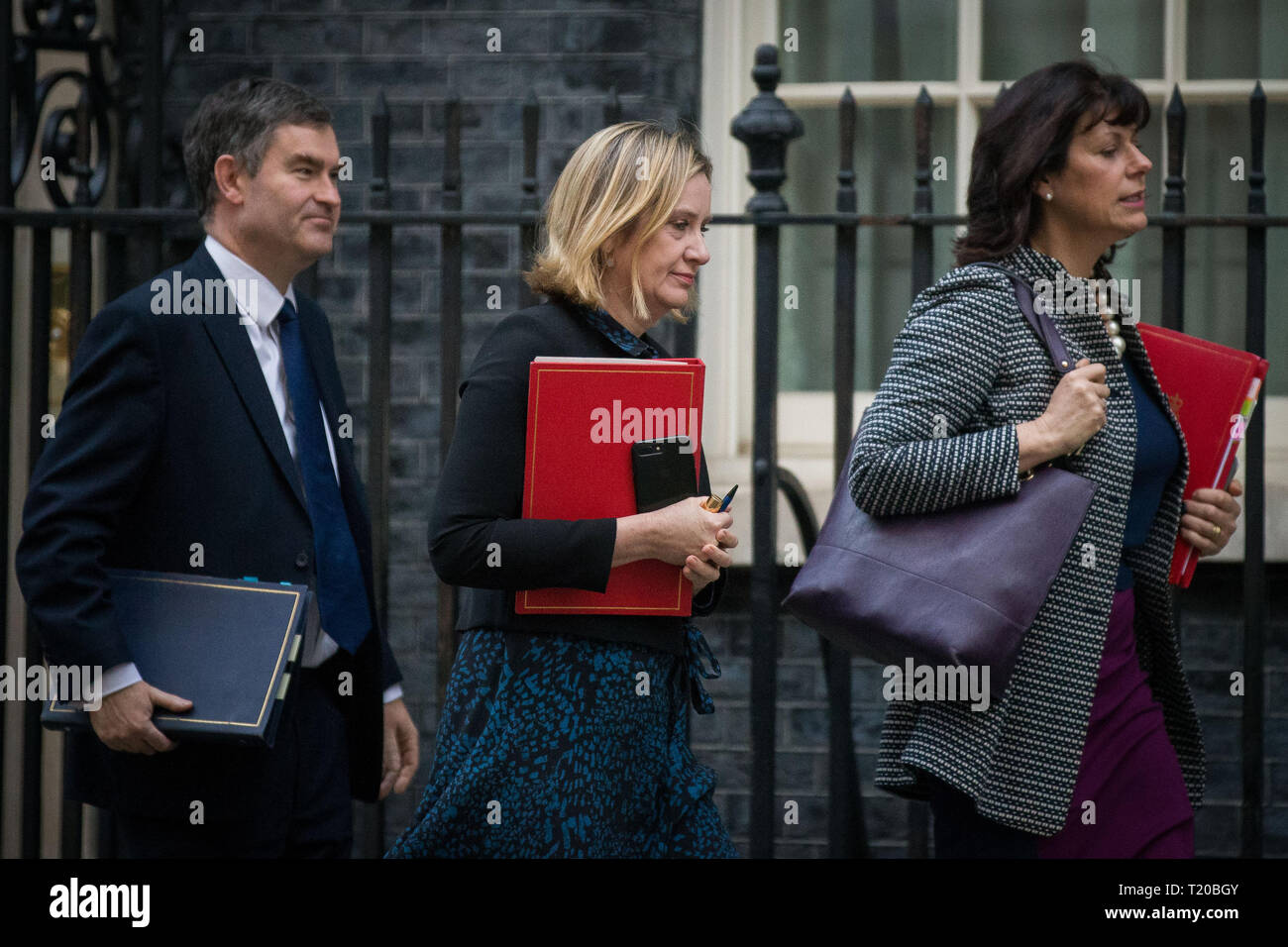 Ministers depart Downing Street following cabinet meeting. Featuring ...