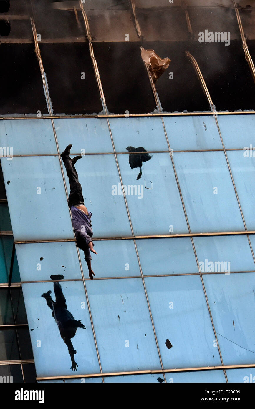 Dhaka, Bangladesh - March, 28, 2019: Several people trapped inside the ...